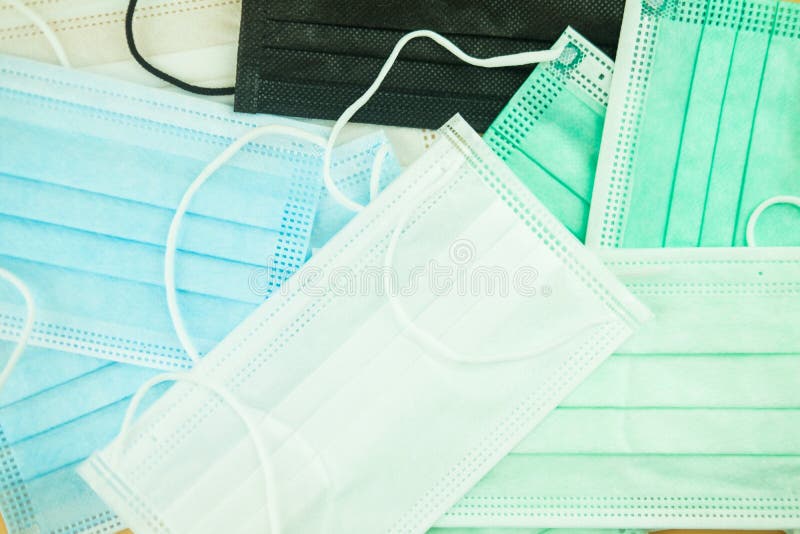 Protective Masks with Ear Loops. Many of Colored Stock Photo - Image of ...