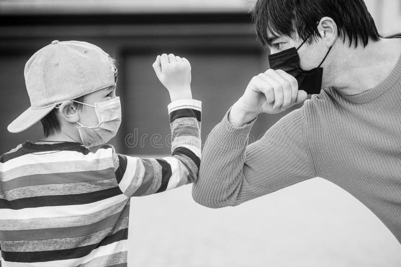 Protective Measures. Father Puts Her Son a Face Protective Mask ...