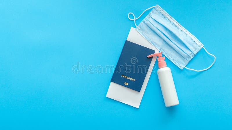 Protective Medical Mask Sanitizer And Passport Airplane Ticket Concept