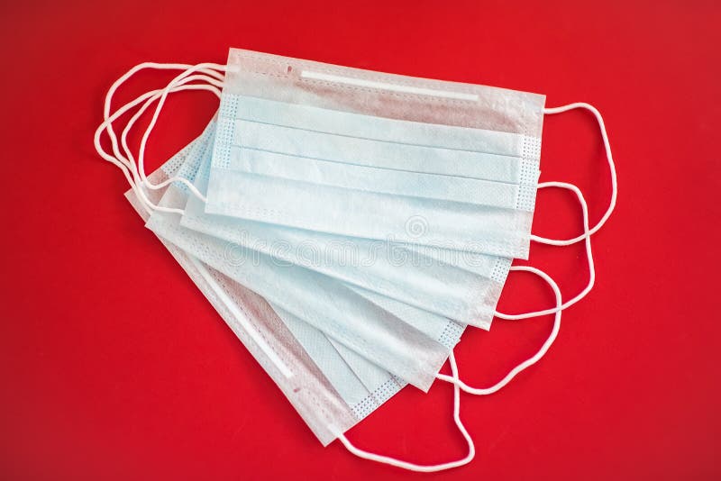 PROTECTIVE MEDICAL MASKS on the RED BACKGROUND Stock Image - Image of ...