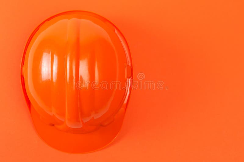 Protective Orange Construction Helmet, on an Orange Background, the ...