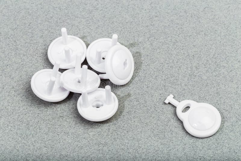 Protective Socket Plugs on Gray Background Child Safety - Image Stock ...