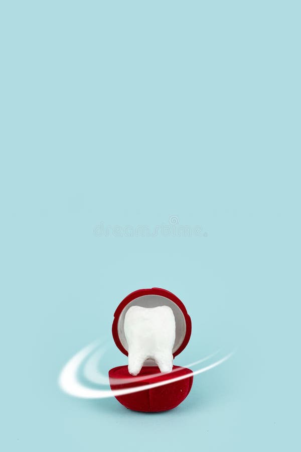 Protective Vortex Around Tooth Model in Gift Box on Blue Background ...