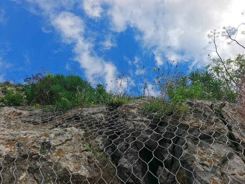 Protective Wire Mesh Fence Over the Rocks. Falling Protection Stock ...