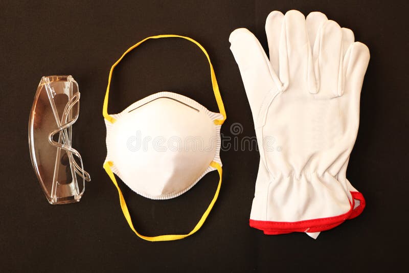 Protective Workers New Mask, Glasses and Gloves on a Black Background ...