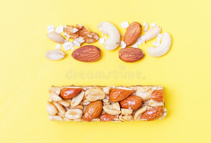 Protein Bars with Nuts on Yellow Background, View from Above. Stock ...