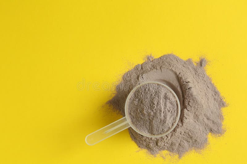 Protein Powder and Scoop on Yellow Background, Top View. Space for Text ...