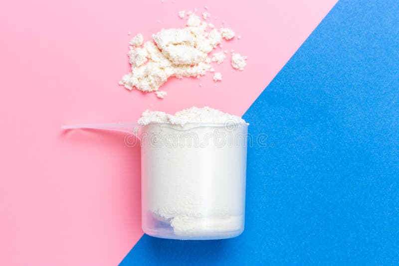 A Protein and Scoop on Blue and Pink Background, Top View. Stock Photo ...