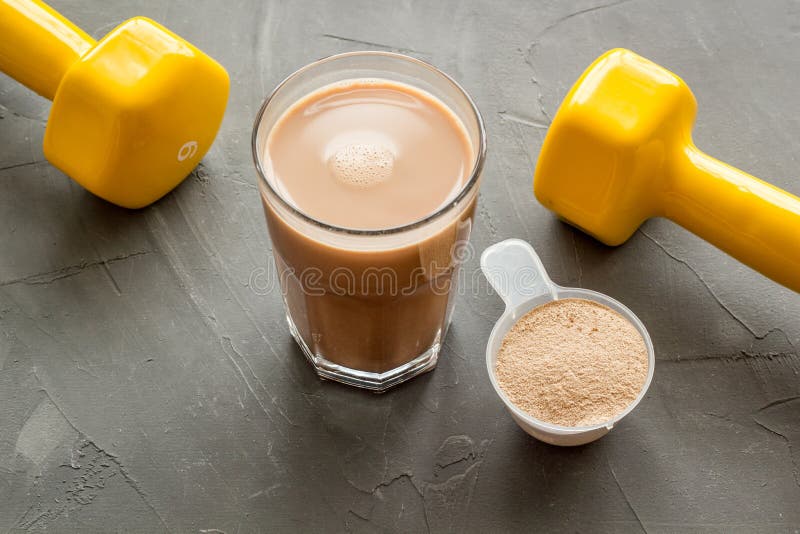 Protein Shake in Glass Near Dumbbells on Grey Background Copy Space ...