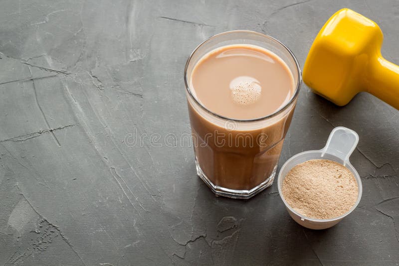 Protein Shake in Glass Near Dumbbells on Grey Background Copy Space ...
