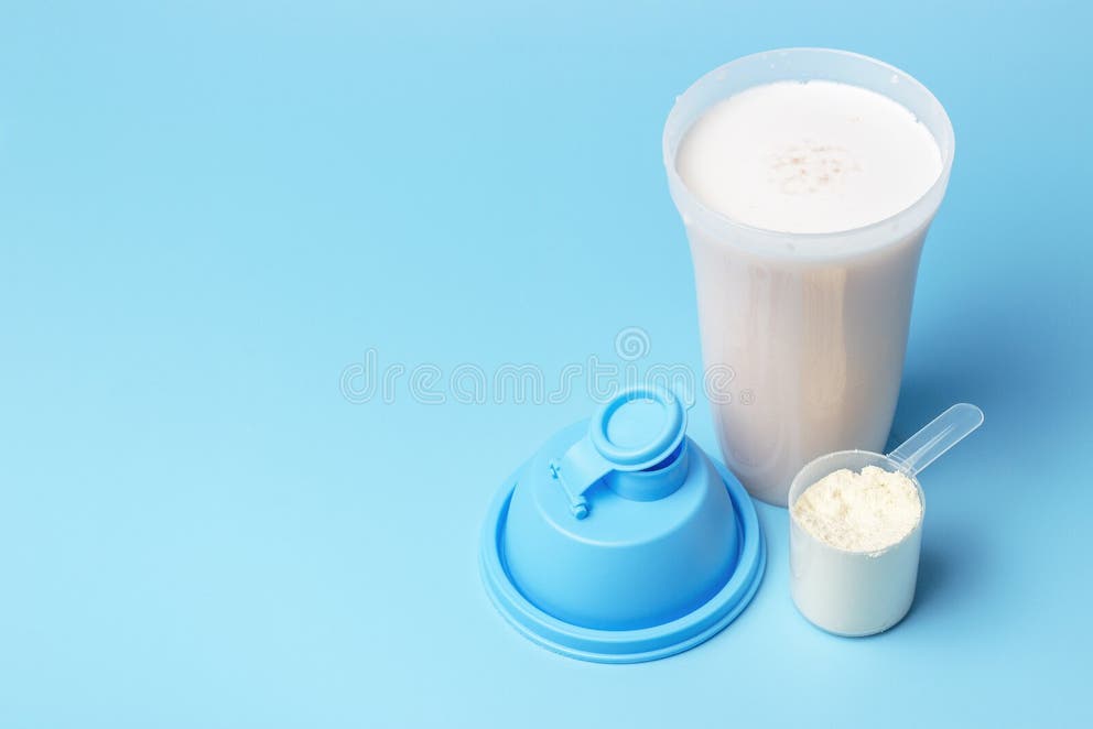 With a Protein Shake and a Measuring Spoon on Blue Background, Copy ...
