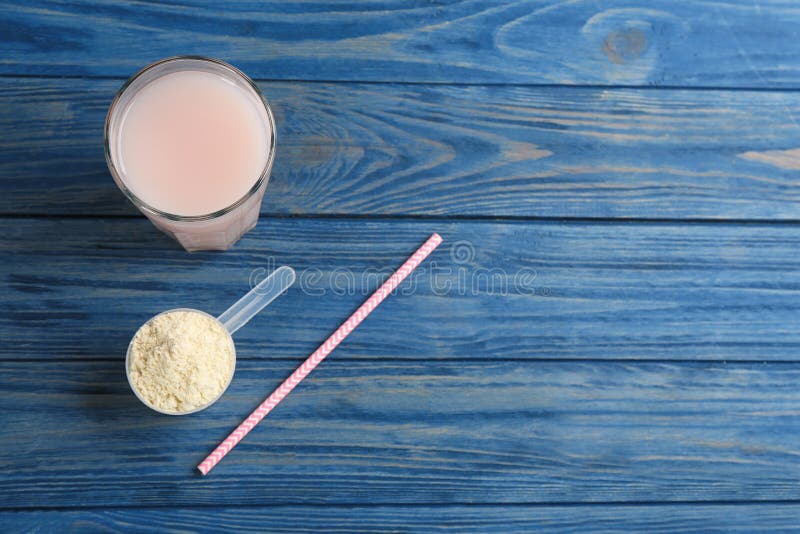 Protein Shake, Powder and Straw on Blue Wooden Table. Space for Text ...