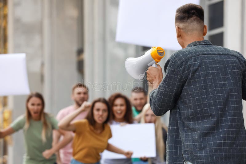 Protest Leader with Megaphone Talking To Crowd Outdoors Stock Image ...