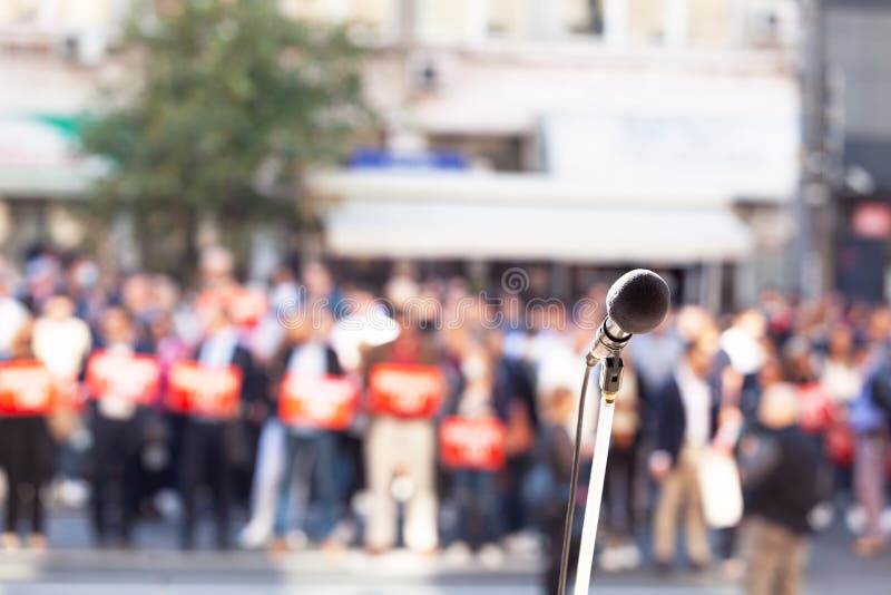 Focus on Microphone, Blurred Group of People at Mass Protest Stock ...