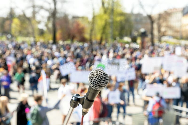 Protest or Public Demonstration, Focus on Microphone, Blurred Group of ...