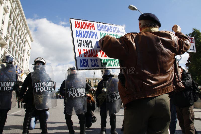 A Protester with Placards Against Riot Police Editorial Stock Image ...