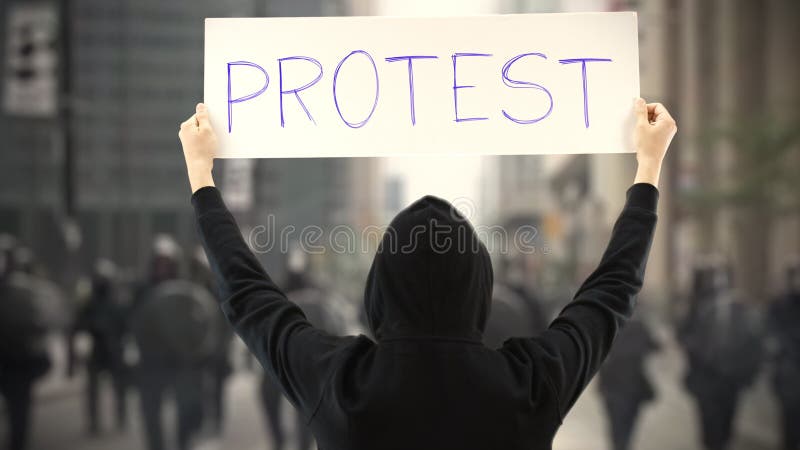 Protester Wearing Black Holds a Placard with PROTEST Text Stock Image ...