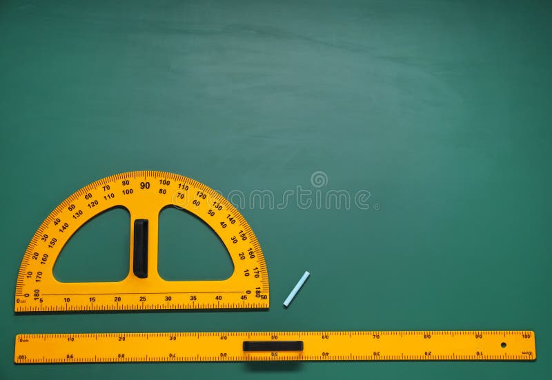 Protractor, Ruler and Chalk on Green Chalkboard, Flat Lay. Space for ...