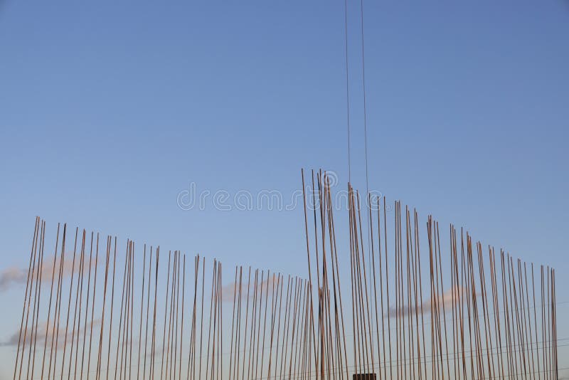 Protruding Construction Rebar Against the Blue Sky, Construction ...