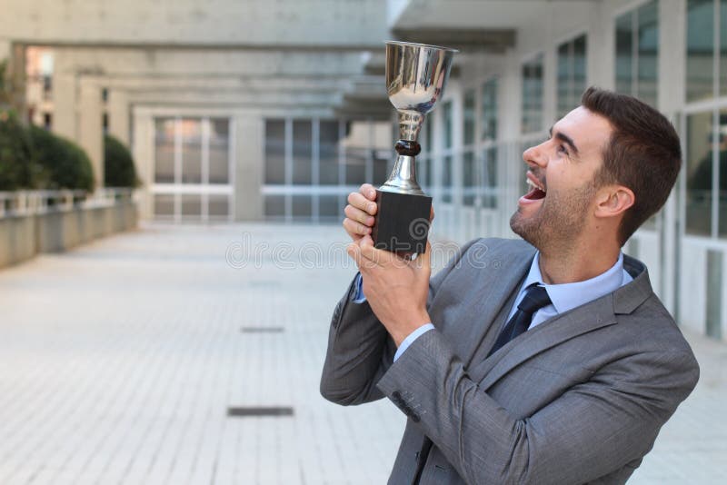 Proud Businessman Holding His Trophy Stock Photo - Image of laughing ... Proud Businessman Holding His Trophy Stock Photo - Image of laughing ...