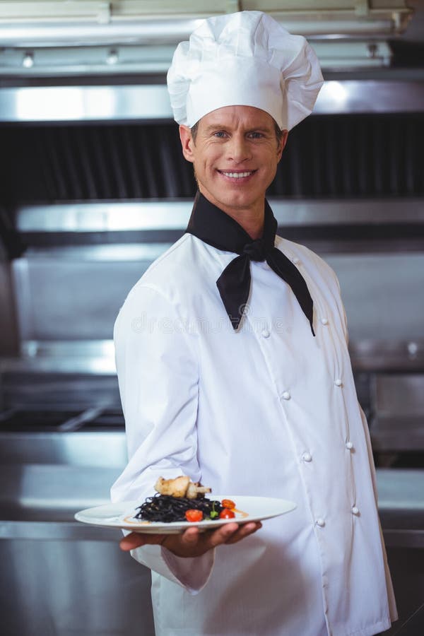 Proud Chef Holding a Plate of Squid Ink Spaghetti Stock Image - Image ...