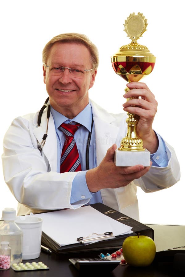 Proud doctor with trophy stock image. Image of medical - 15444795