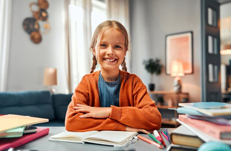 Academic Achievements. Proud First Grader Sitting with Hands Folded by ...