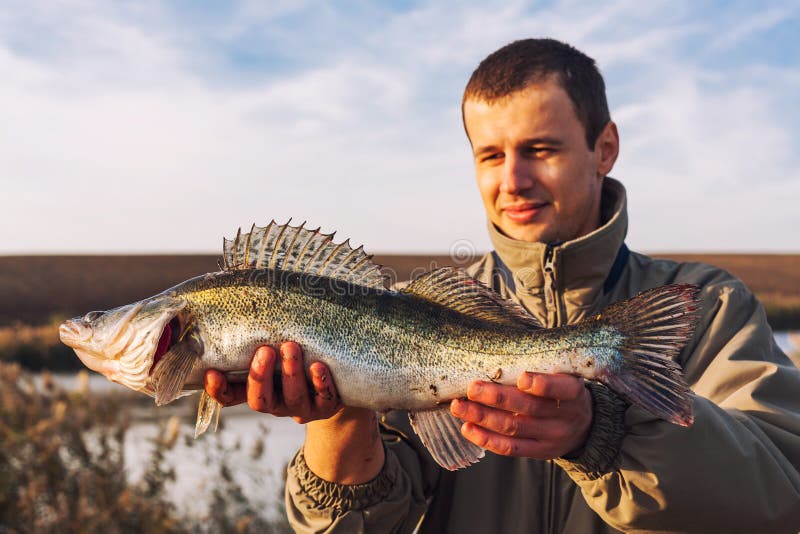 Proud fisherman with catch stock image. Image of showing - 27976297