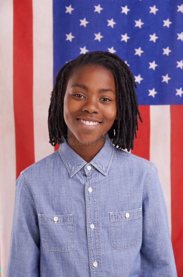 Proud of His Country. Portrait of a Happy Young Boy Standing in Front ... Proud of His Country. Portrait of a Happy Young Boy Standing in Front ...