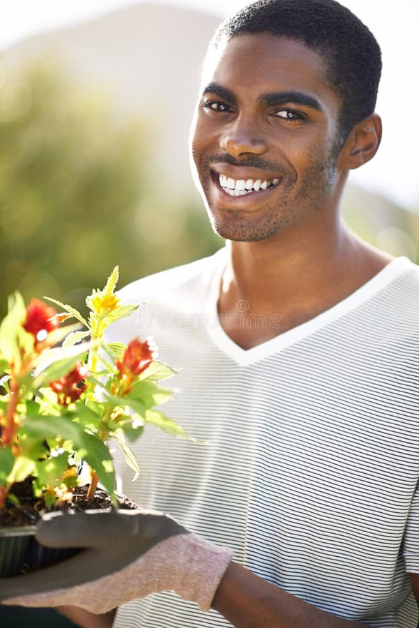 Proud of His Plants. Portrait of a Handsome Young Man Gardening. Stock ... Proud of His Plants. Portrait of a Handsome Young Man Gardening. Stock ...