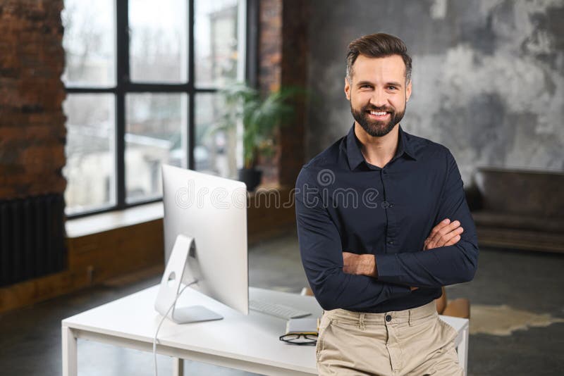 Proud and Successful Young Businessman in Smart Casual Wear with Arms ... Proud and Successful Young Businessman in Smart Casual Wear with Arms ...