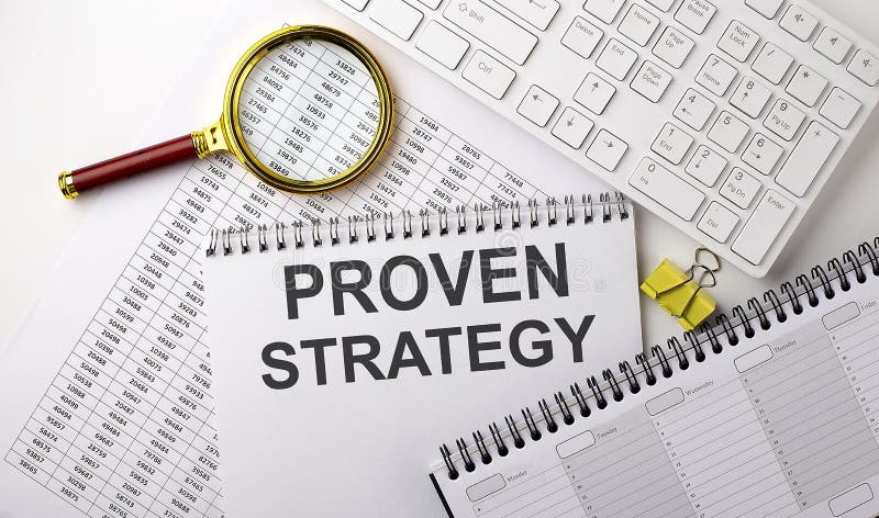 PROVEN STRATEGY Text Written on Notebook on the Chart with Keyboard and ...