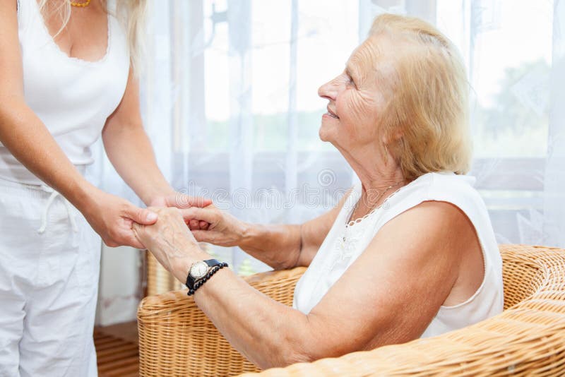 Providing care for elderly stock image. Image of happy - 43204081