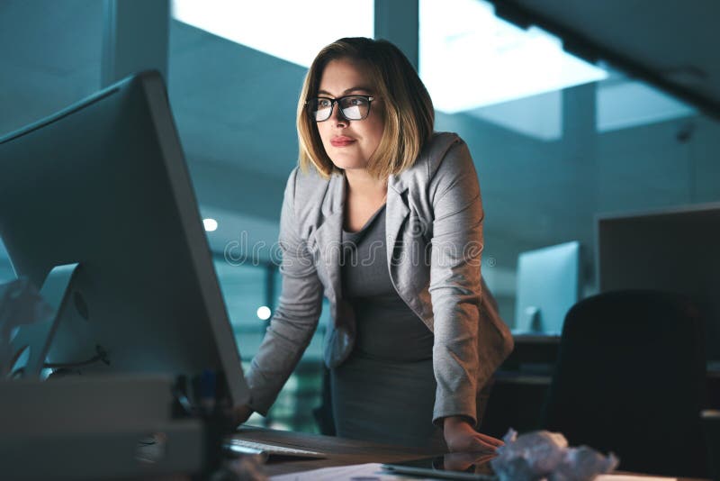 Proving Her Ambition through Hard Work. a Young Businesswoman Working ...