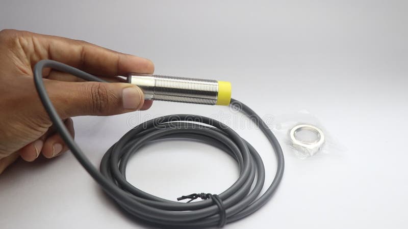 Proximity Sensor of NPN and Capacitance Type Held in the Hand on a ...