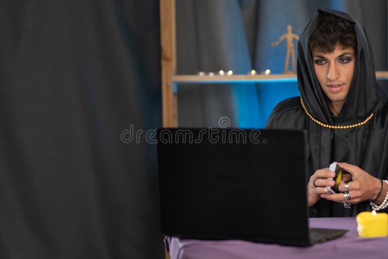 Psychic Tarot Card Reader on Laptop Computer Having an Online Session ...