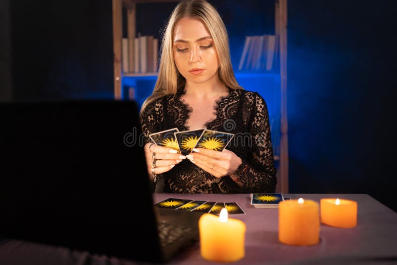 Psychic Tarot Card Reader on Laptop Computer while Having an Online ...