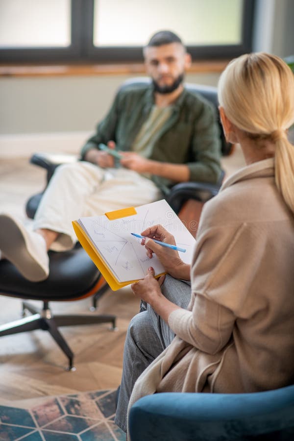 Psychoanalyst Making Notes while Listening To Client Stock Image ...