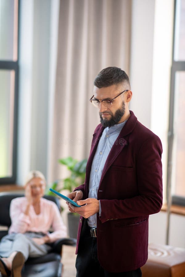 Psychologist Holding Tablet and Reading Info about Patient Stock Photo ...