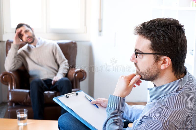 Psychologist Taking Notes during Session Stock Photo - Image of hands ...