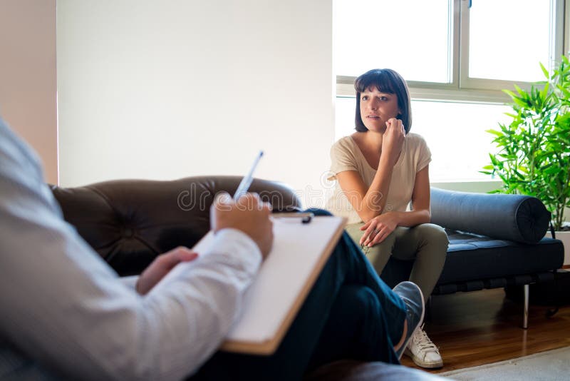 Psychologist Taking Notes during Therapy Session. Stock Photo - Image ...