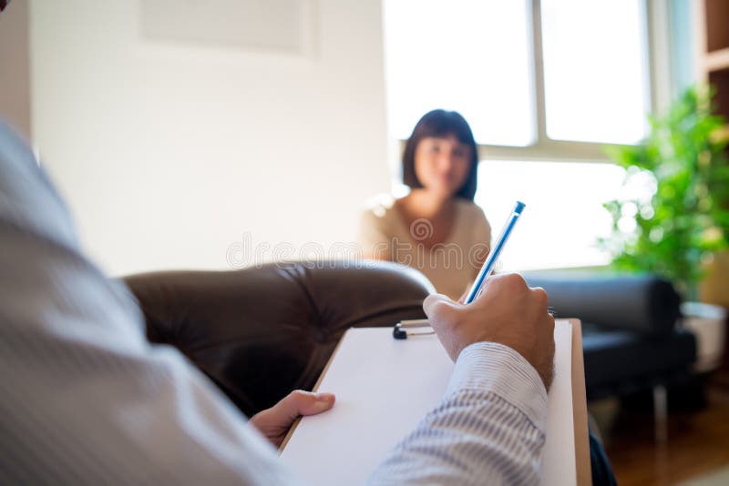 Psychologist Taking Notes during Therapy Session. Stock Photo - Image ...