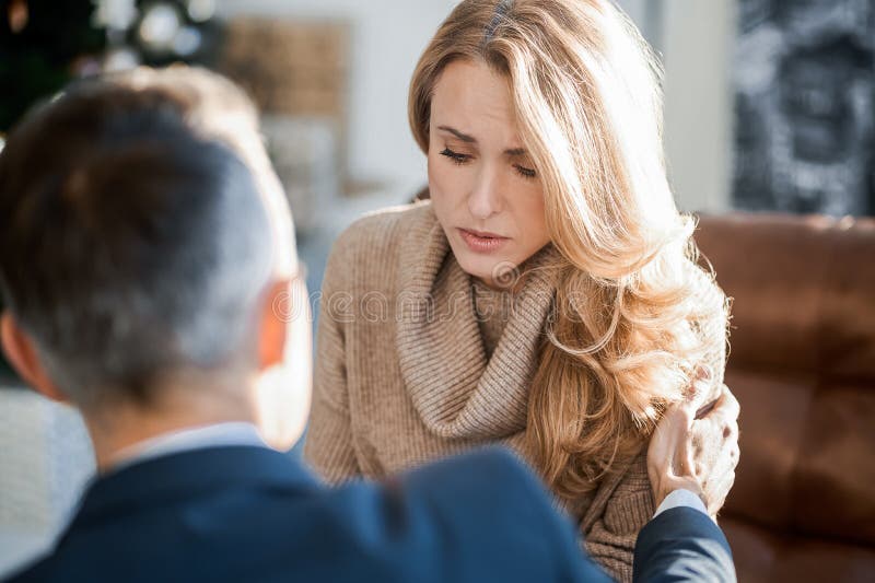 Psychologist Talking To a Client and Looking Friendly Stock Photo ...