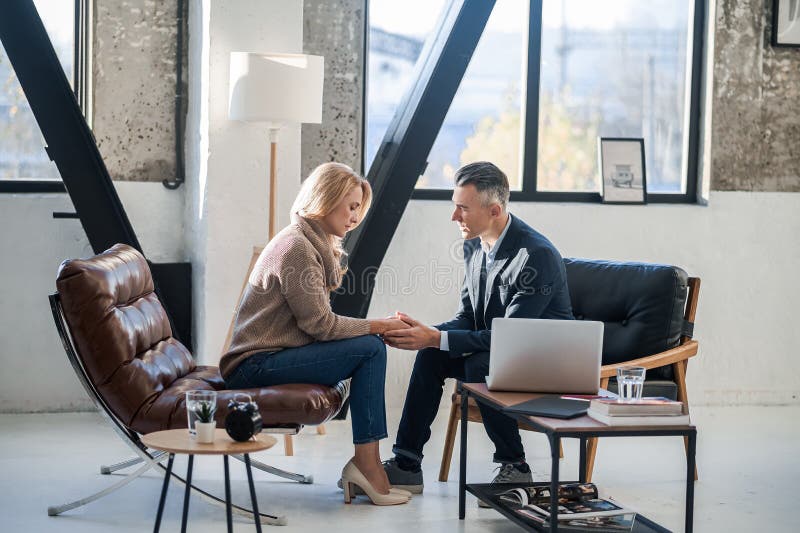 Psychologist Talking To a Client and Looking Friendly Stock Photo ...