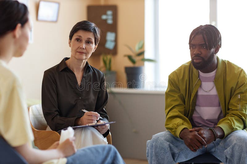 Psychologist Working with People at Session Stock Photo - Image of ...