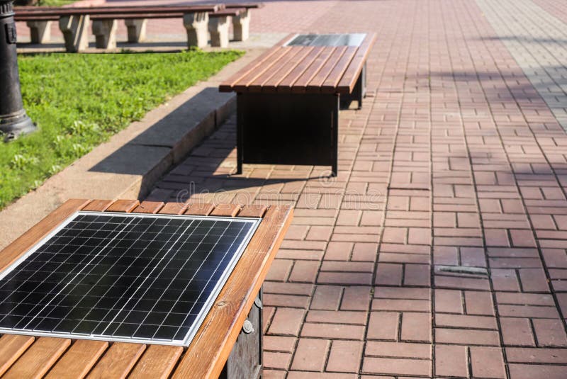 Public Charging on Bench with Solar Panel on Street. Alternative ...