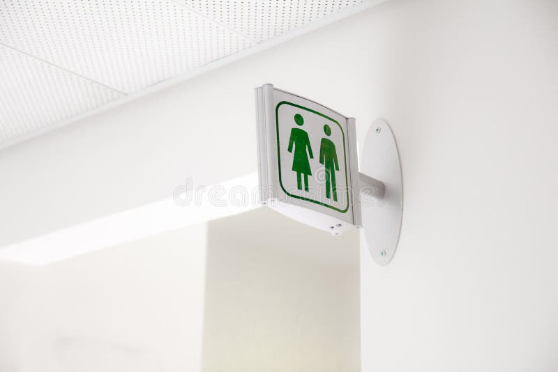 Public Modern White and Green Restroom Sign on White Wall Stock Photo ...
