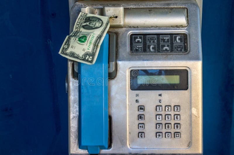 A Public Payphone with Two Dollar Banknote Looking Out Stock Photo ...