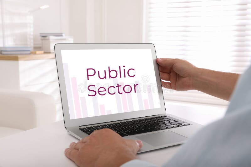 Public Sector. Man Working with Modern Laptop at White Table, Closeup ...