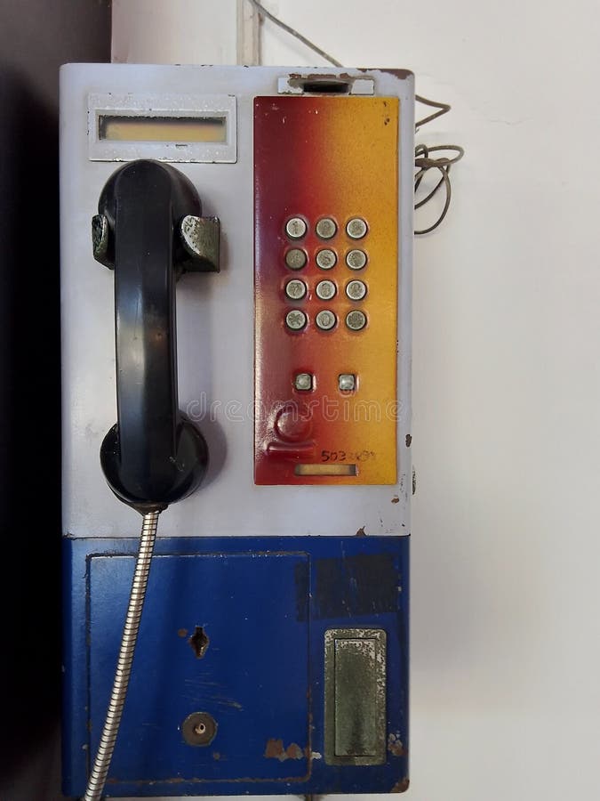 Public telephone use coins stock photo. Image of wood - 333792188